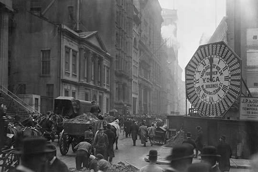 Wagons trundle along Manhattan Streets past a YMCA clock sign ...