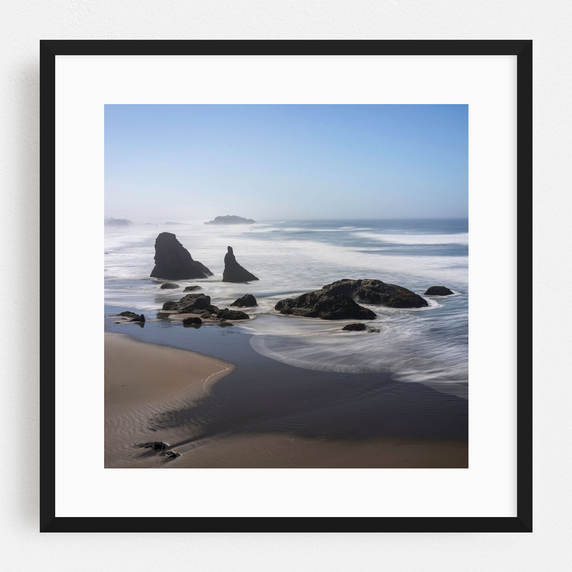Waves gently lap against scenic rocky outcrops - Bandon Oregon ...