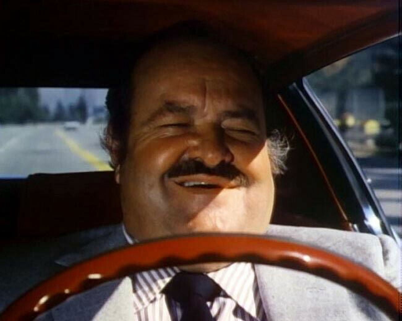 William Conrad smiling at the wheel of his Lincoln Continental Cannon ...
