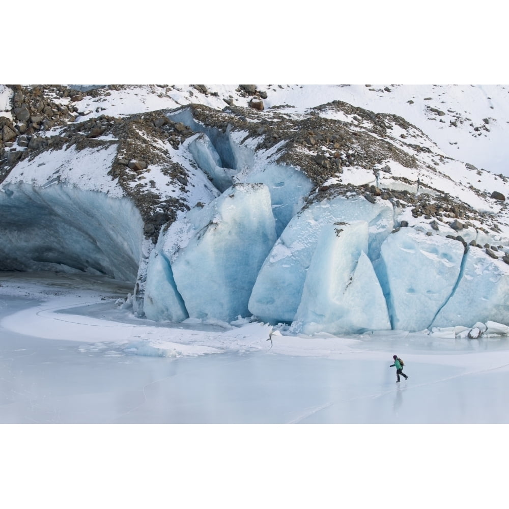 Woman Ice Skating In Front Of Saddlebag Glacier, Chugach Mountains Near ...