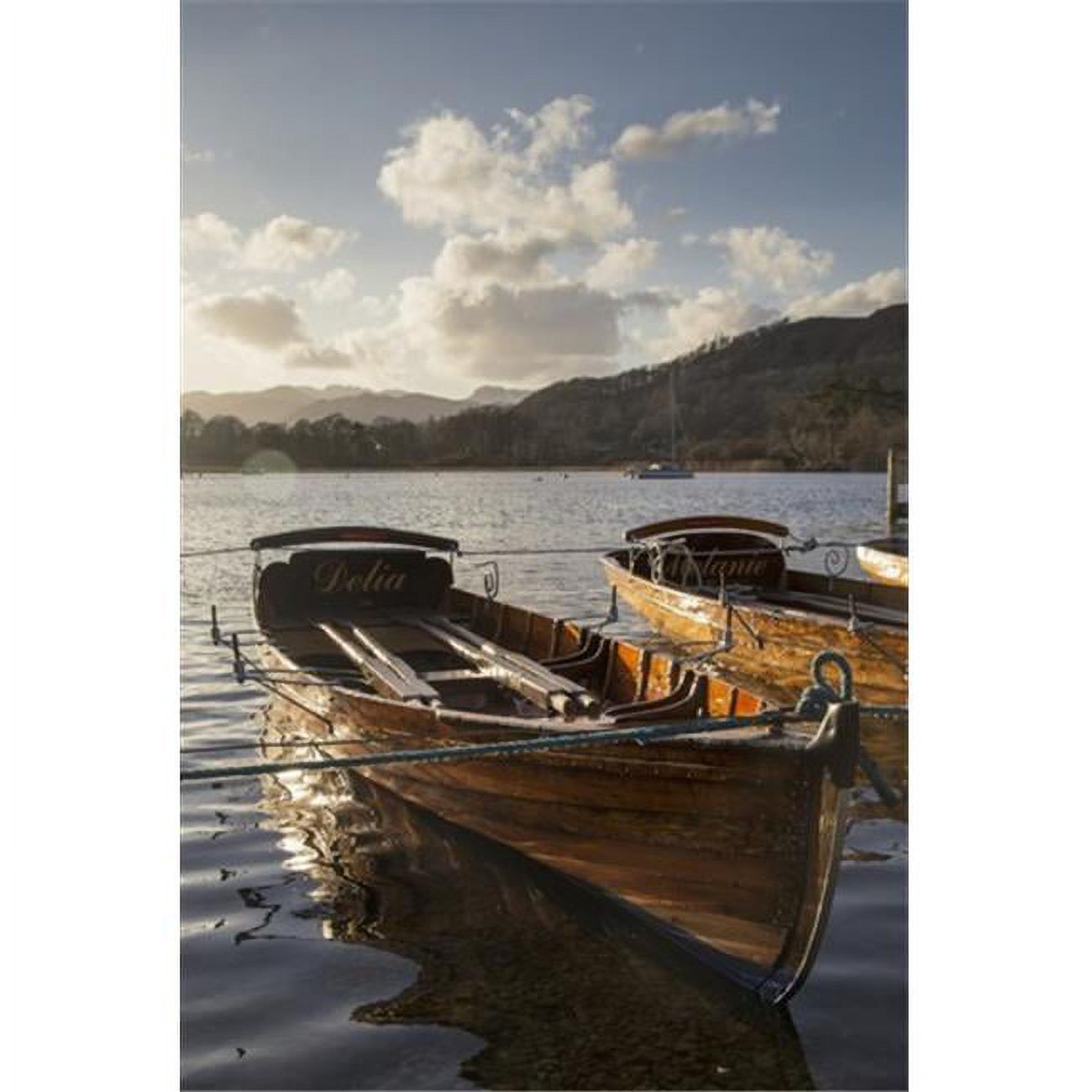 Wooden Boats Tied At The Waters Edge On A Tranquil Lake - South ...
