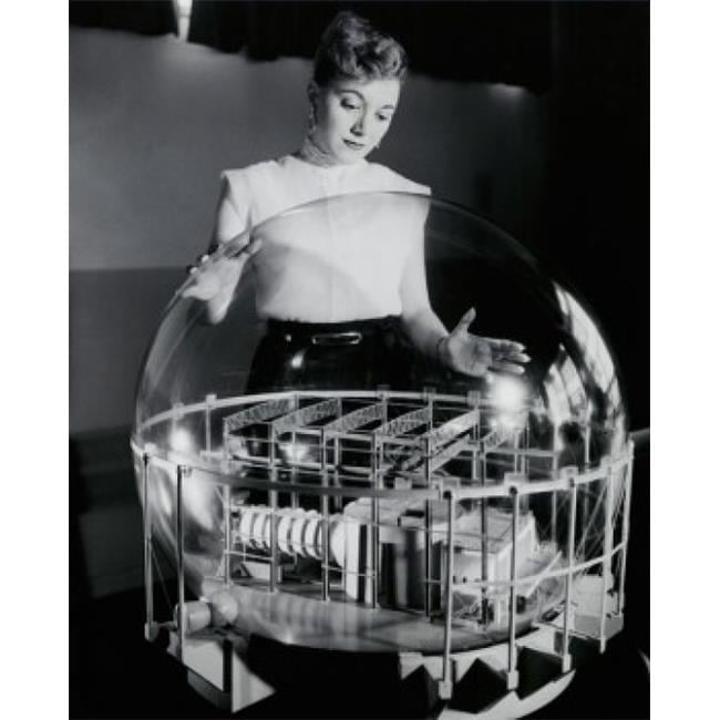 Young Woman Looking At A Model of A Nuclear Reactor Covered with Sphere ...