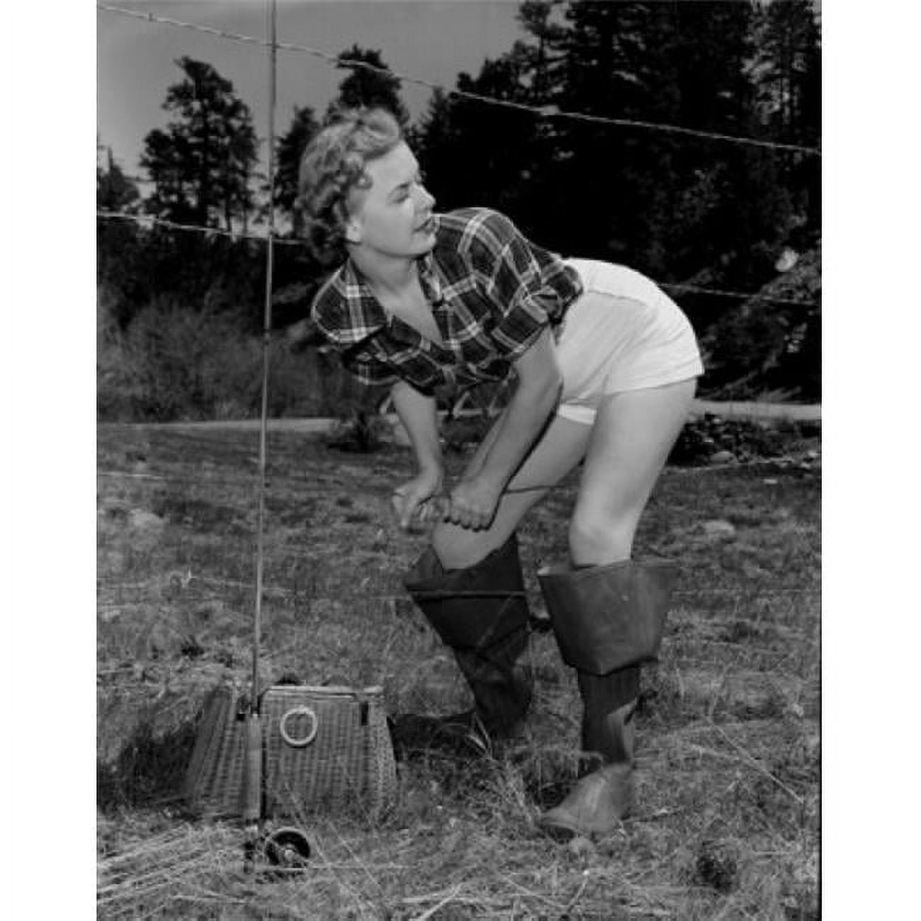 Young Woman with Fishing Rod & Basket Crossing Barbed Wire Fence Poster ...