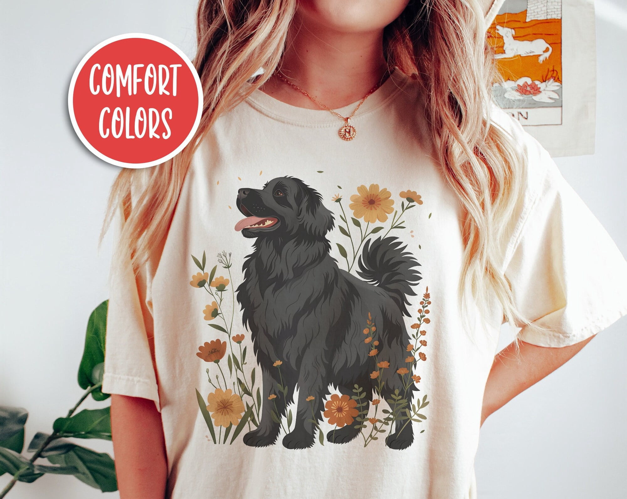 black and white illustration of a dog with flowers on a cream colored ...