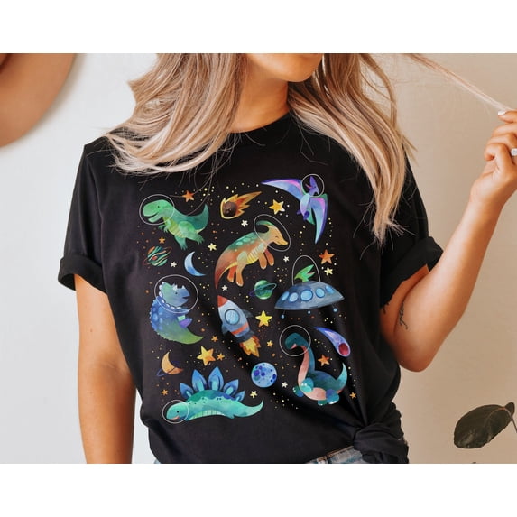 black tshirt with a colorful graphic print of dinosaurs in space The ...