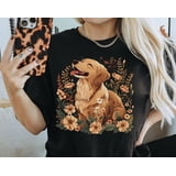 black tshirt with a graphic of a golden retriever dog sitting in a ...