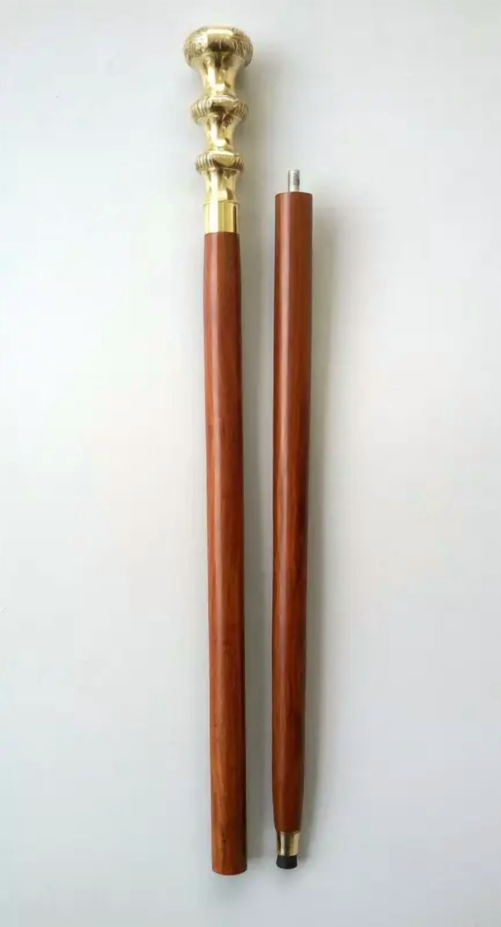 brass knob style golden handle with brown wooden walking stick cane ...