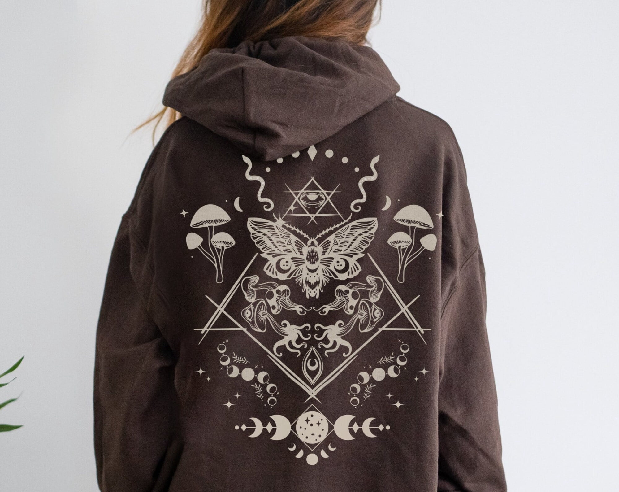 brown hooded TShirt with a graphic print of a moth mushrooms and moon ...