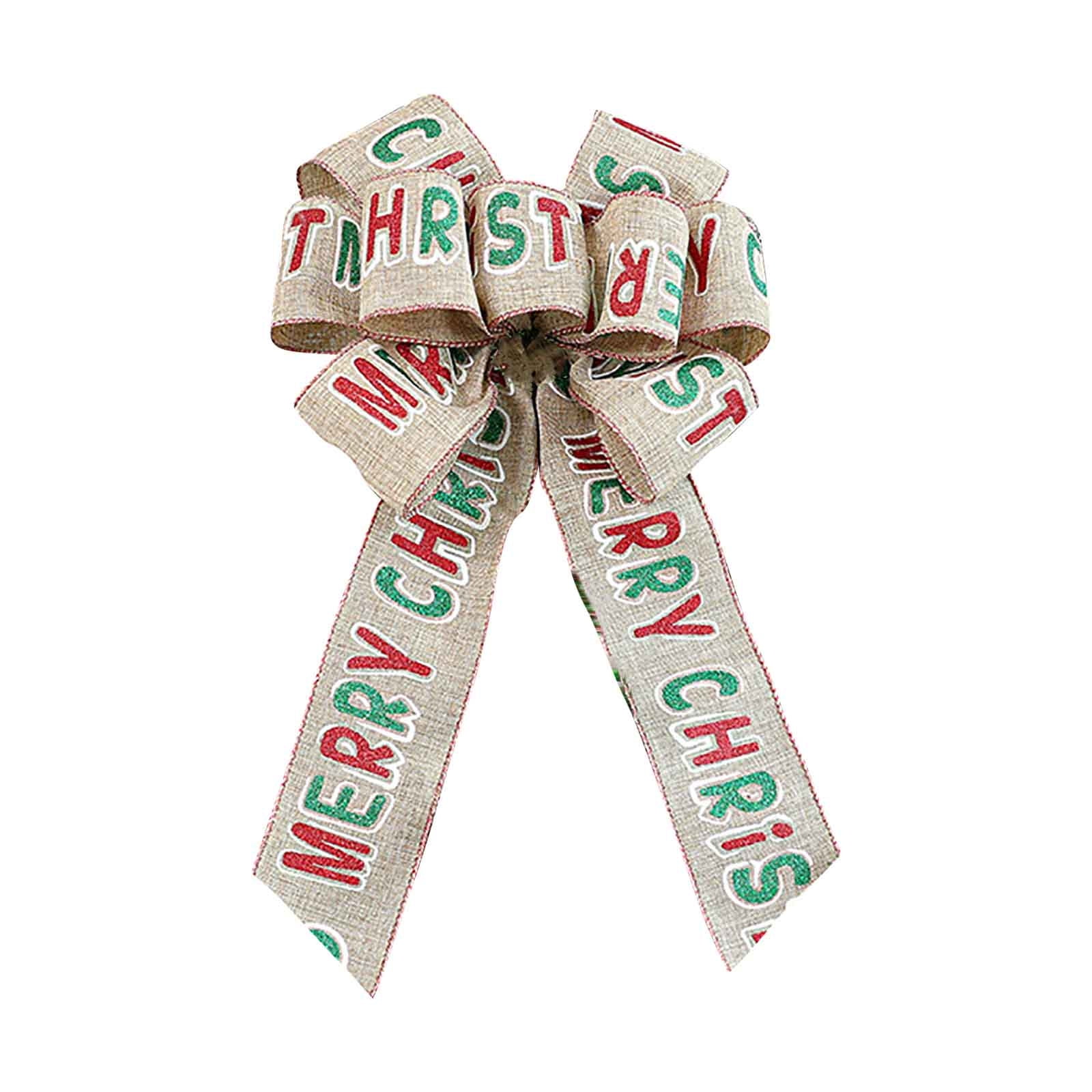 christmas decorations The large bow on the top of the Christmas tree is ...