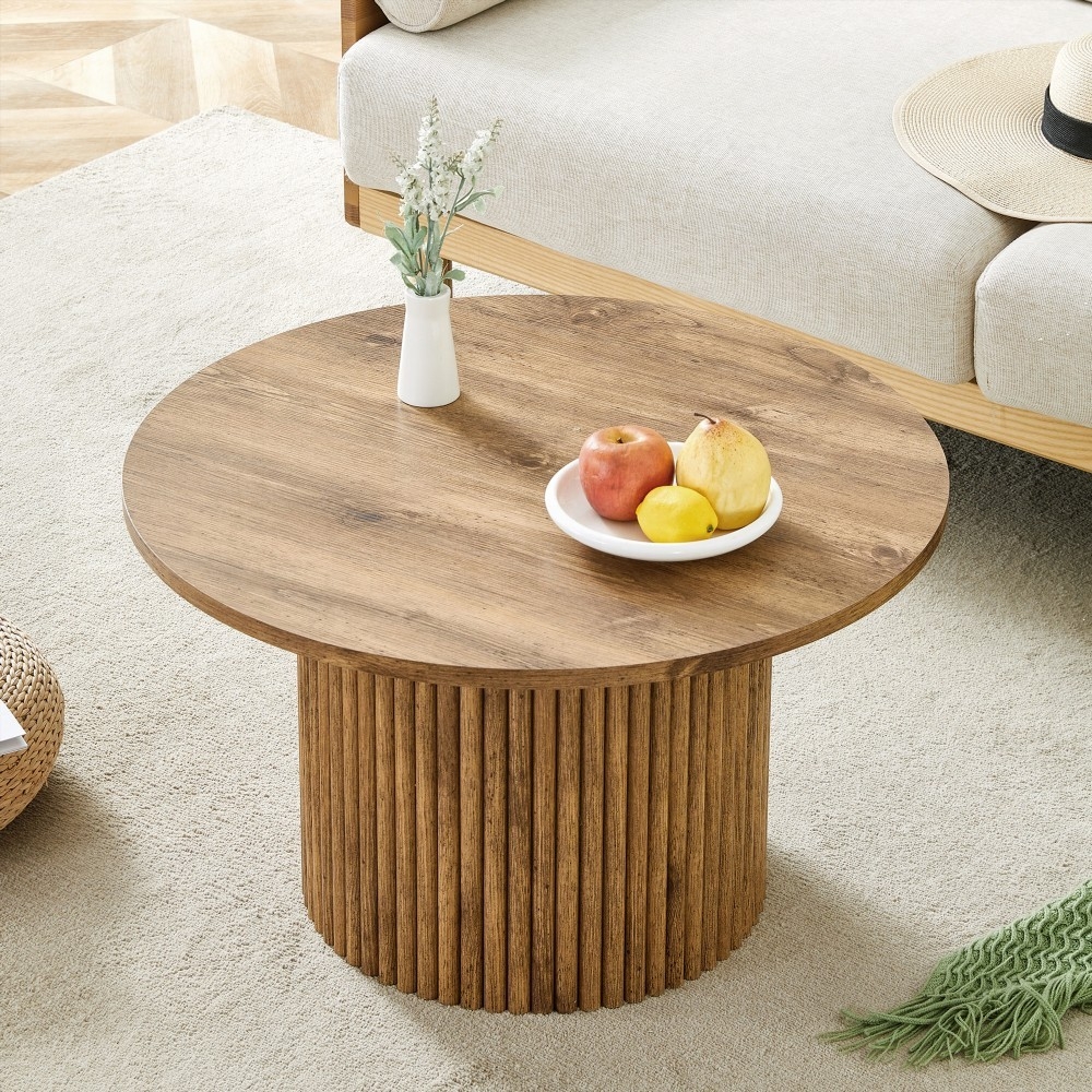 A circular coffee table of 27.5 inches diameter in MDF with wood ...