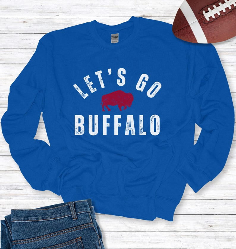 This crewneck sweatshirt with a vintage-style, distressed "Let's Go ...