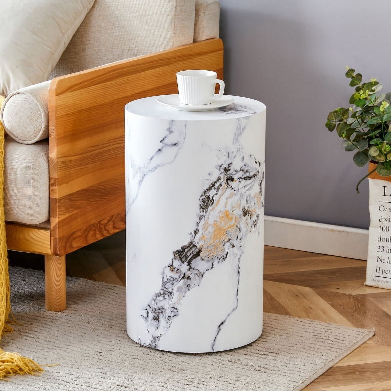 The cylindrical table with its patterned design can be easily ...