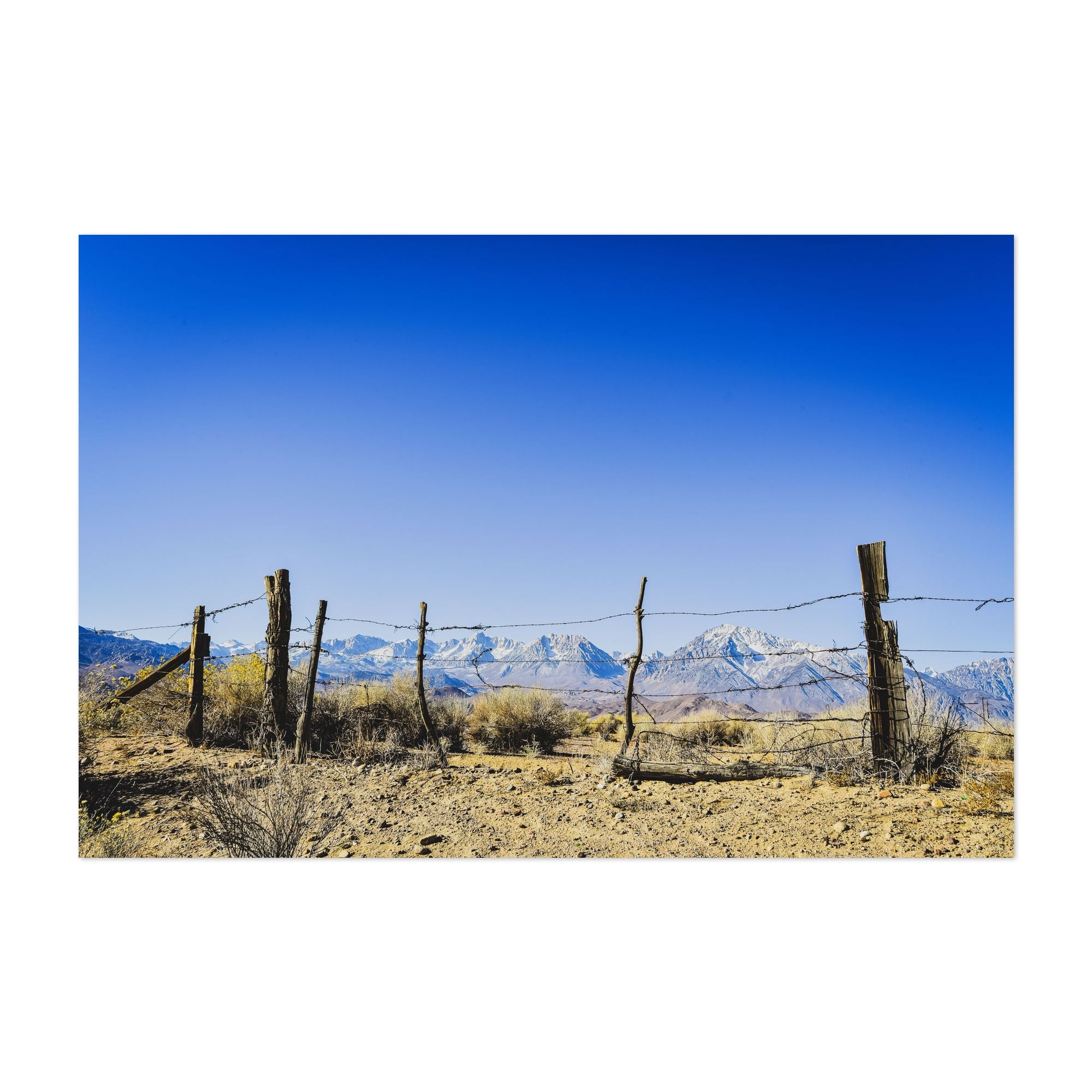 fence in high desert with snowy mountains - Bishop California ...