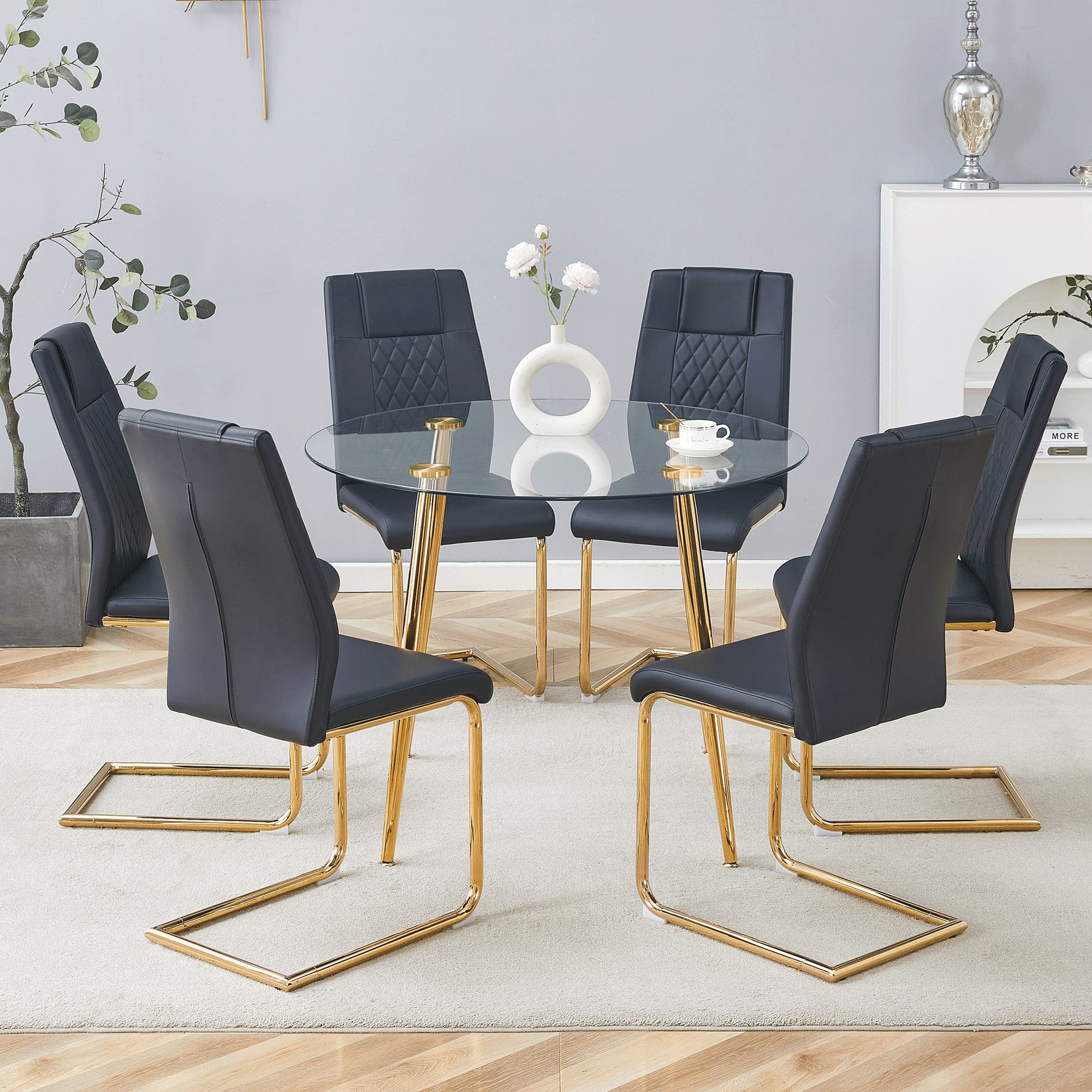 A modern minimalist style round transparent tempered glass table with ...