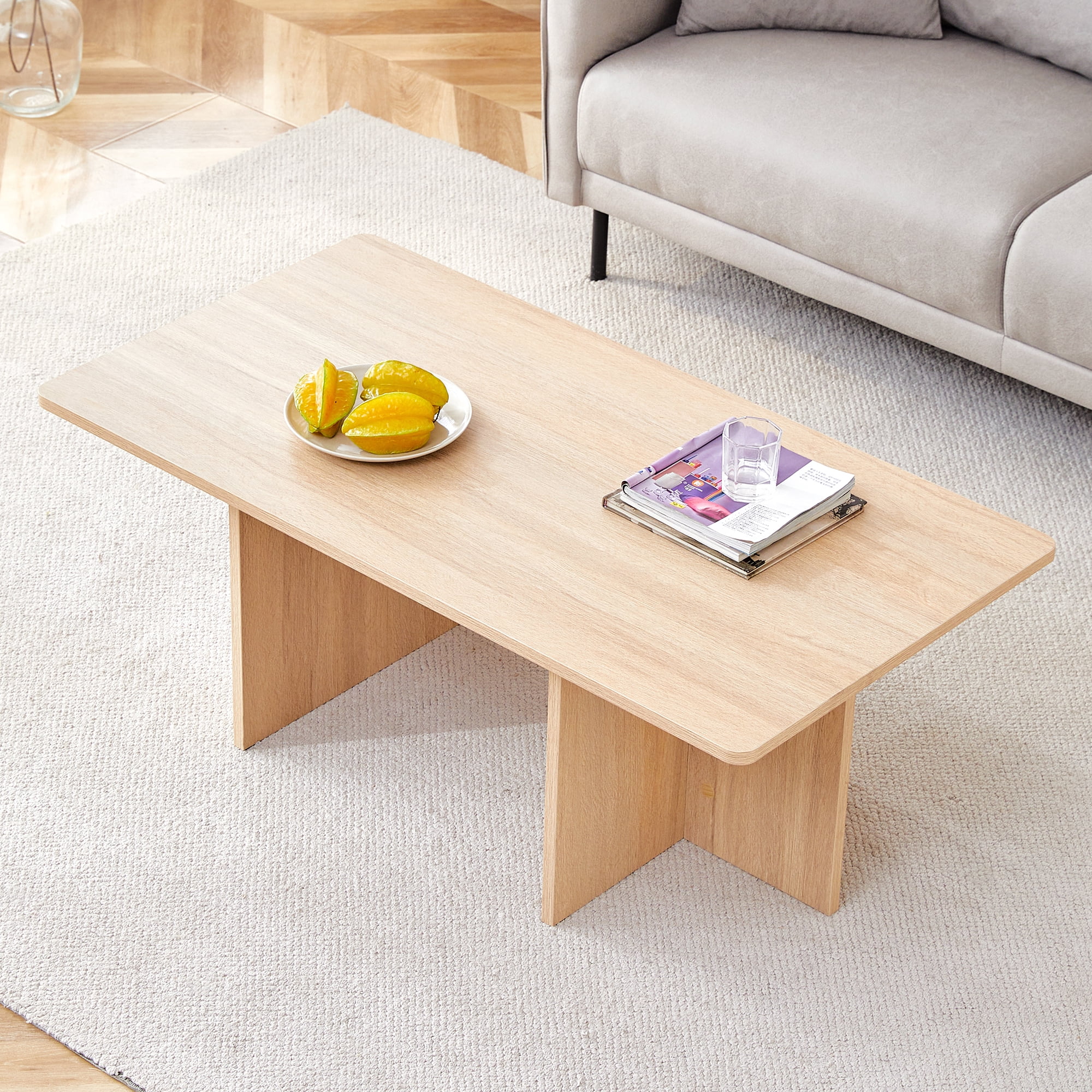 A modern and practical wood colored coffee table. The coffee table is ...