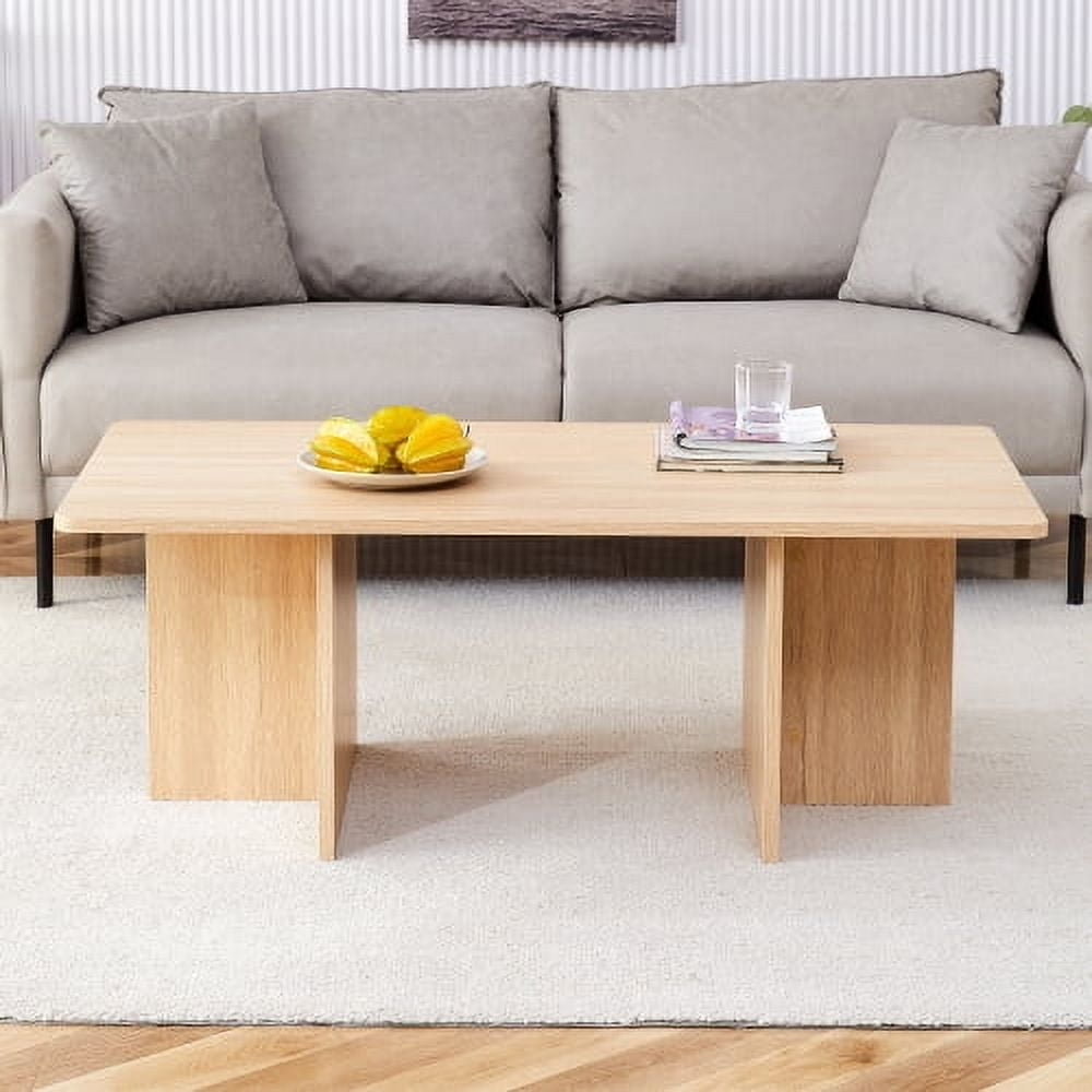 A modern and practical wood colored coffee table. The coffee table is ...