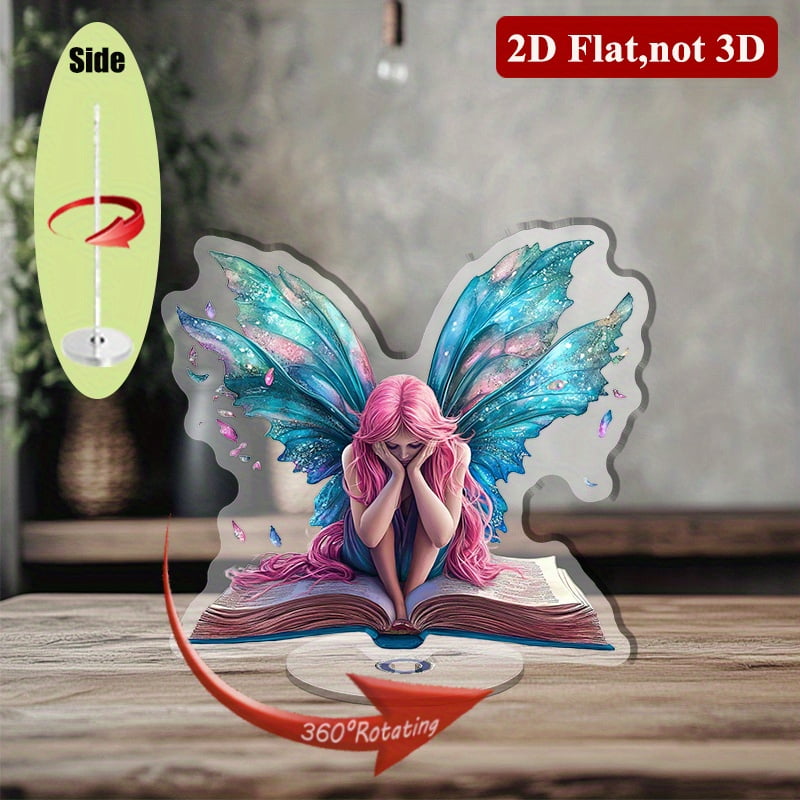 A rotating acrylic display featuring a pink fairy with blue wings on an open book, showcasing ...