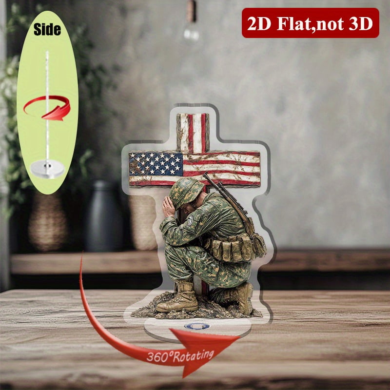 A rotating acrylic display featuring a soldier kneeling in prayer ...