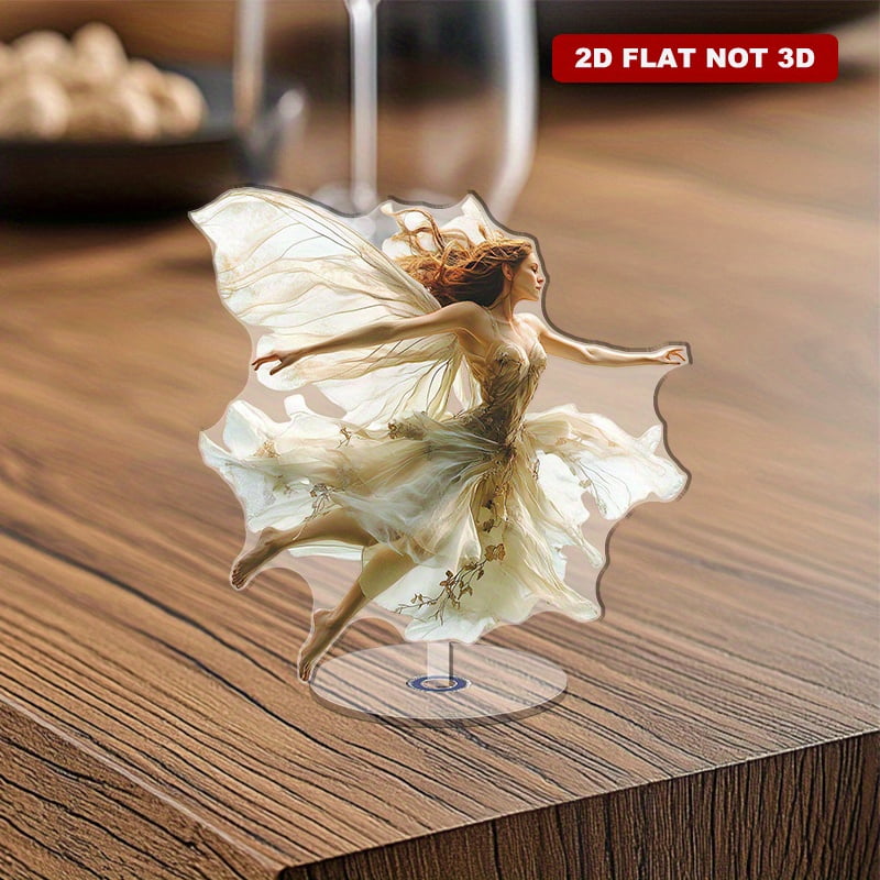 A rotating acrylic display featuring a stunning mid-flight fairy with ...