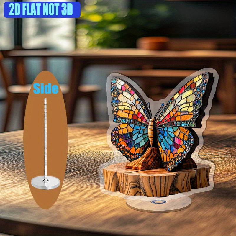 A rotating acrylic display featuring a vibrant butterfly sculpture with ...