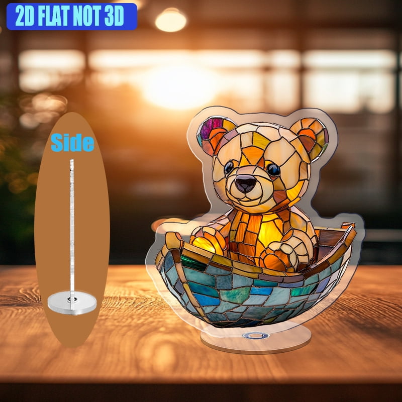 A rotating acrylic display featuring a vibrant stained glass baby bear ...