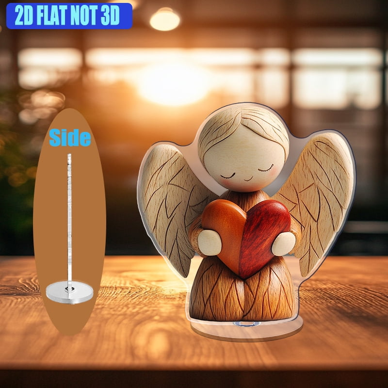 A rotating acrylic display piece featuring a hand-carved angel with a ...
