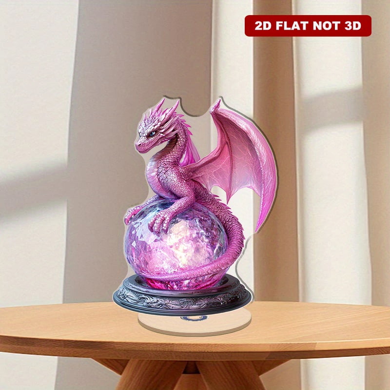A rotating acrylic ornament featuring a pink dragon perched on a ...