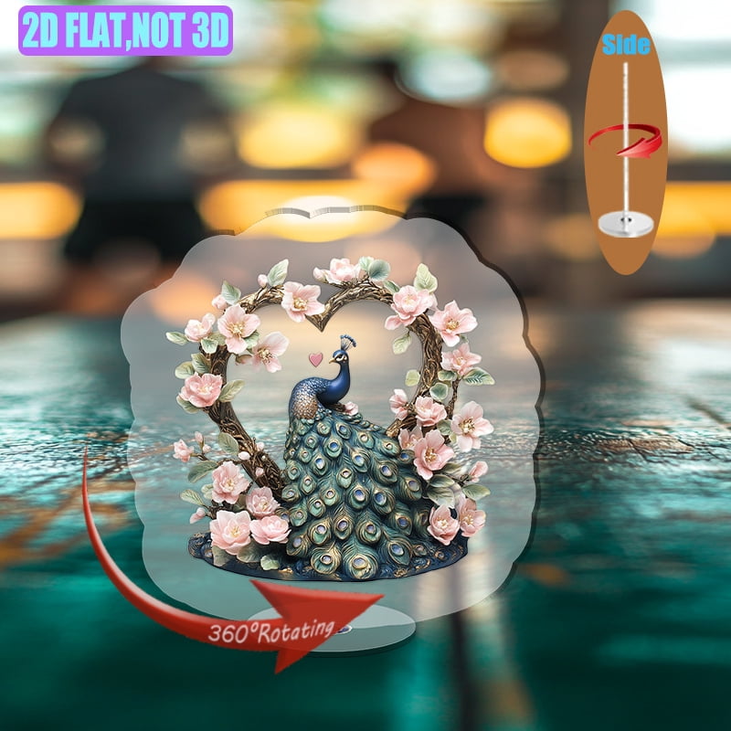 A rotating acrylic sculpture featuring a lifelike peacock with vibrant ...