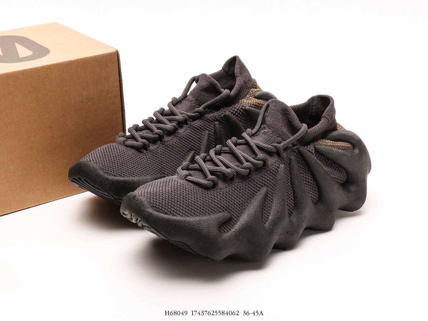 The y-e-e-z-y 450 coal black sneakers are made of woven upper material ...